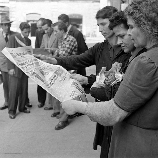People Reading Newspaper During First Democratic Editorial Stock Photo ...