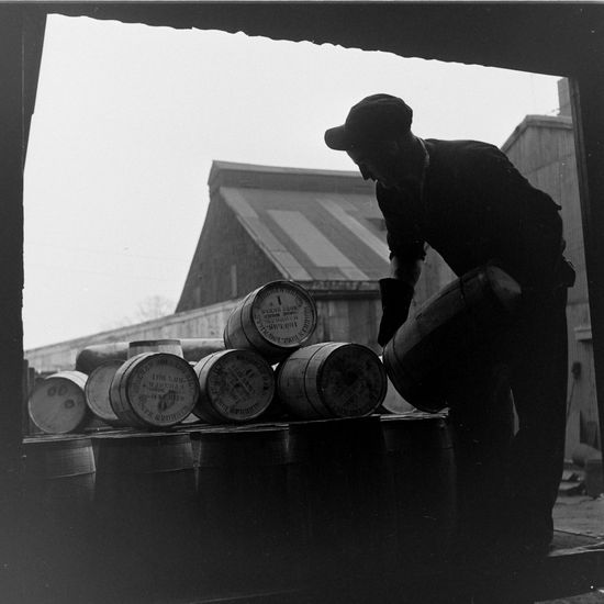 Man Carrying Barrel On Horseshoe Workshop Editorial Stock Photo - Stock ...