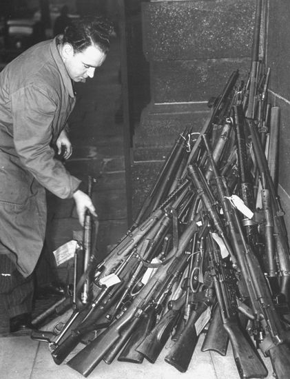 April 1946 Man Stacking Rifles Which Editorial Stock Photo - Stock ...