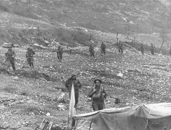 Soldiers Walking Advance Across Battle Scarred Editorial Stock Photo ...