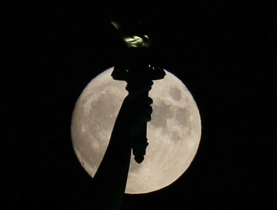 Nearly Full Moon Rises Behind Torch Editorial Stock Photo - Stock Image ...