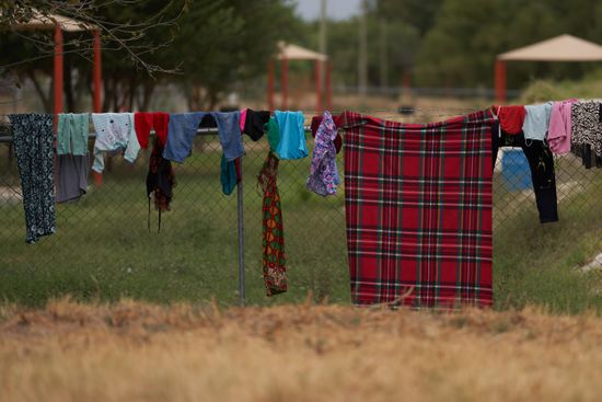 Laundry Hangs Dry On Barbed Wire Editorial Stock Photo - Stock Image | Shutterstock