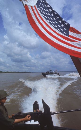American Flag Flying Above Machine Gunner Editorial Stock Photo - Stock ...