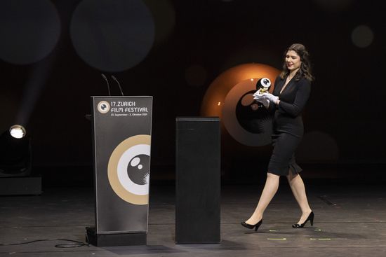 Woman Shows Golden Eye Award During Editorial Stock Photo - Stock Image ...