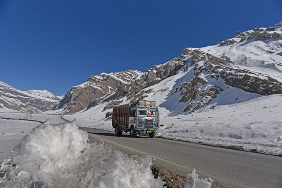 Truck Moves Along Snow Covered Mountain Editorial Stock Photo - Stock ...