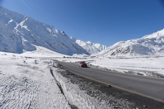 Vehicle Moves Along Snow Covered Mountain Editorial Stock Photo - Stock ...