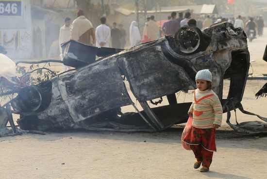 Child Walks Past Burntout Vehicles Set Editorial Stock Photo - Stock ...