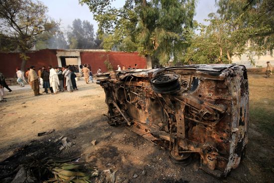 People Walk Past Burntout Vehicles Set Editorial Stock Photo - Stock ...