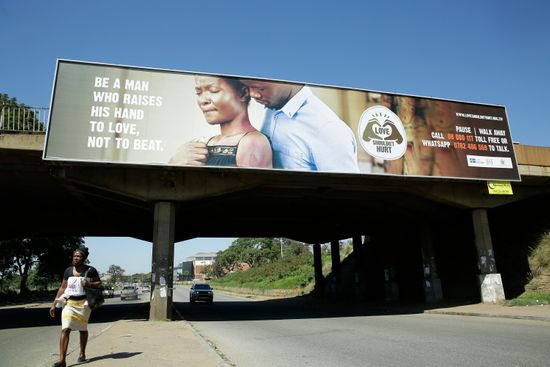Woman Walks Past Billboard On Gender - Foto de stock de contenido ...