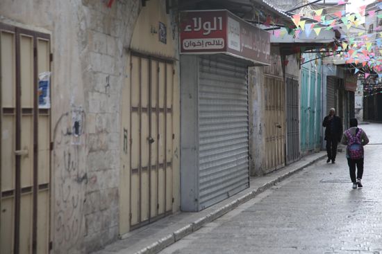 Palestinian Man Walks Past Shuttered Stores Editorial Stock Photo ...