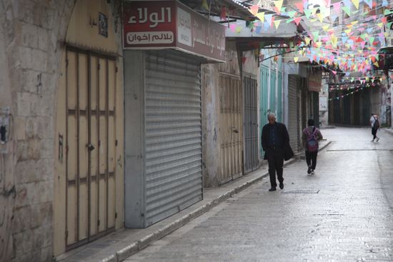 Palestinian Man Walks Past Shuttered Stores Editorial Stock Photo ...