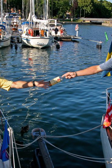 Person Boat Handing Over Whiskey Bottle Editorial Stock Photo - Stock ...