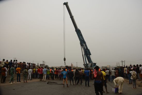 People Watch Tanker Being Hoisted Out Editorial Stock Photo - Stock ...