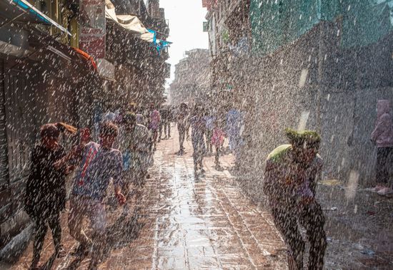 People Run Through Water Sprayed During Editorial Stock Photo - Stock ...