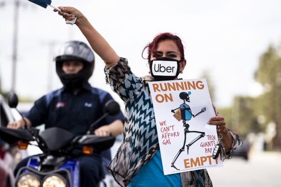 Demonstrator Wearing Uber Mask Holds Sign Editorial Stock Photo - Stock ...