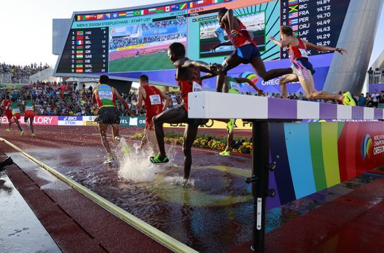 Runners Crosses Hurdle Water During Mens Editorial Stock Photo - Stock ...
