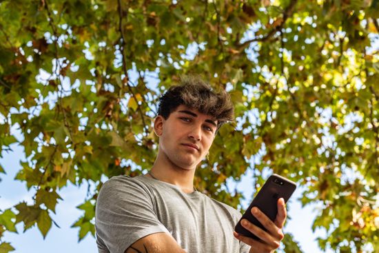 Low Angle Young Man Holding His Editorial Stock Photo - Stock Image | Shutterstock