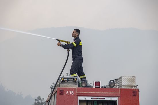Firefighter Pumping Water Onto Fire Roof Editorial Stock Photo - Stock ...