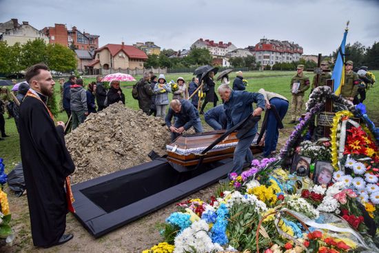 Undertaker Lowers Coffin Into Grave During Editorial Stock Photo ...