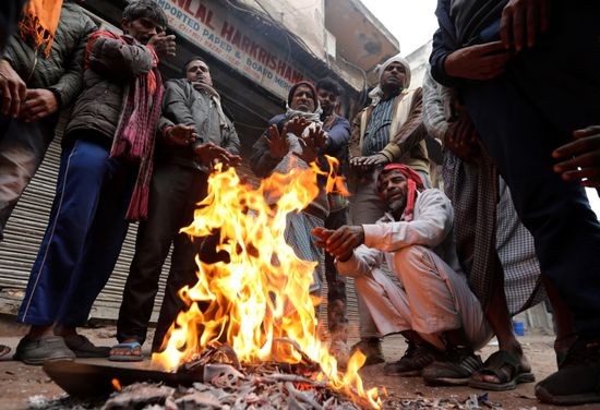 People Warm Themselves Near Fire During Editorial Stock Photo - Stock ...