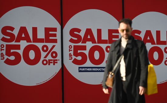Shopper Walks Past Sale Signs On Editorial Stock Photo - Stock Image ...