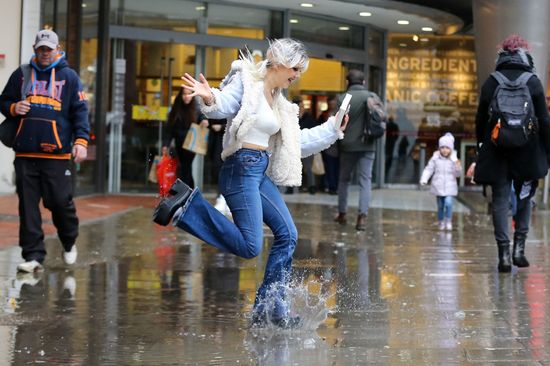 Woman Jumps Over Large Puddle Rainwater Editorial Stock Photo - Stock ...