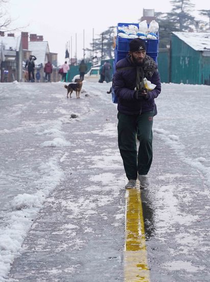 Laborer Carries Milk Crates Through Snow Editorial Stock Photo - Stock ...