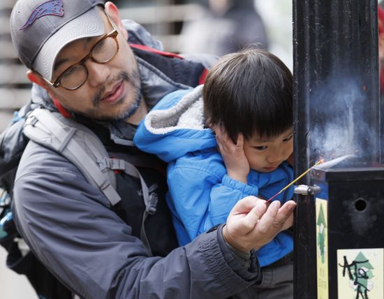 Man Helps Young Boy Ignite Firecrackers Editorial Stock Photo - Stock ...