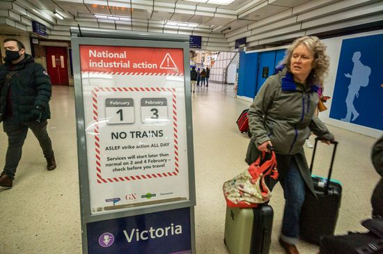 Passengers Walk Past Information Signs On Editorial Stock Photo - Stock ...