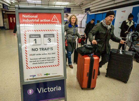 Passengers Walk Past Information Signs On Editorial Stock Photo - Stock ...