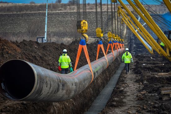 Workers Walk Past Pipe Construction Site Editorial Stock Photo - Stock ...