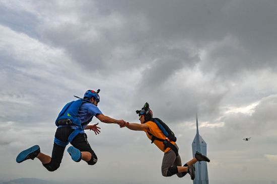 Base Jumpers Hold Hands They Leap Editorial Stock Photo - Stock Image ...