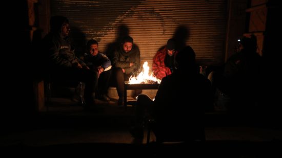 People Warm Themselves Around Fire Near Editorial Stock Photo - Stock ...