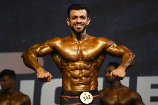 Competitor Flexes His Muscles During Body Editorial Stock Photo - Stock ...