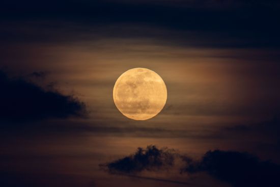 Full Moon Rises Behind Clouds Above Editorial Stock Photo - Stock Image ...