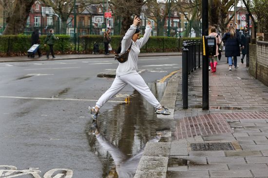 Woman Jumps Over Puddle Rainwater North Editorial Stock Photo - Stock ...