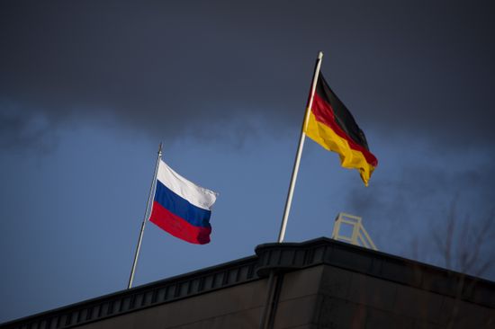 German Russian Flags Fly Against Blue Editorial Stock Photo - Stock ...