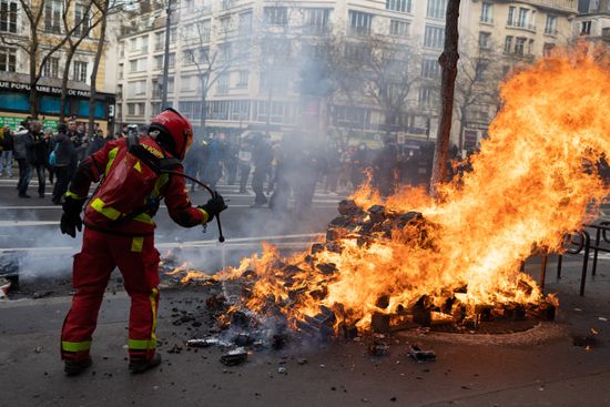 Firefighters Extinguish Burning Barricades During Demonstration ...