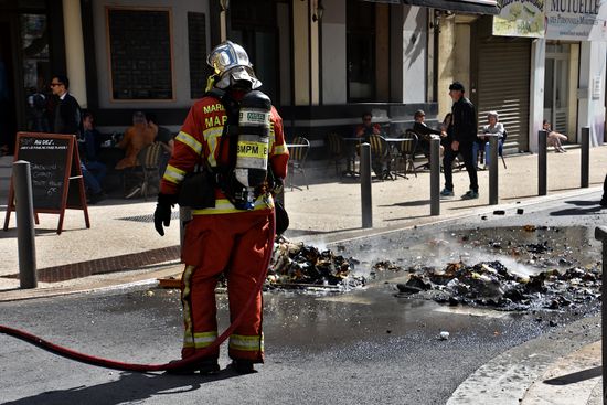 Firefighter Puts Out Trash Fire During Editorial Stock Photo - Stock ...
