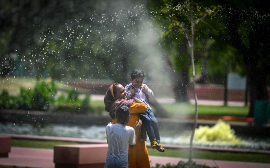 Family Enjoys Water Jet Water Sprinklers Editorial Stock Photo - Stock ...