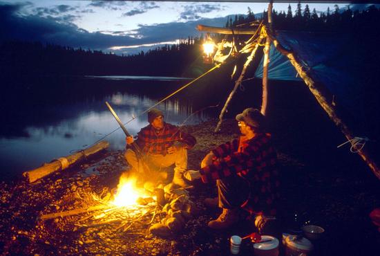 Two Hunters Sitting Campfire By Lake Editorial Stock Photo - Stock ...