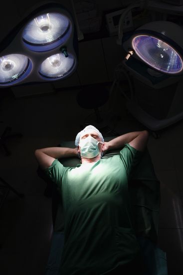 Tired Surgeon Sleeping On Operating Table Editorial Stock Photo - Stock ...