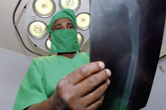Radiologist Examining Xray Underneath Surgical Editorial Stock Photo ...