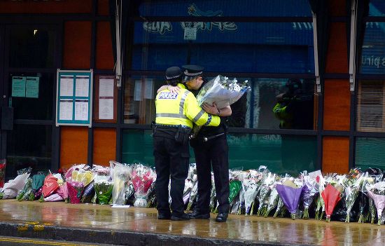 Police Officer Laying Flowers Editorial Stock Photo - Stock Image ...