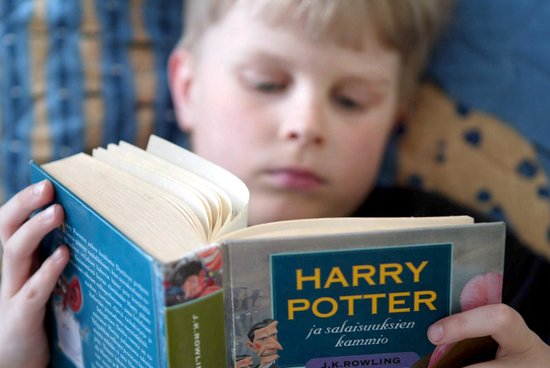 Child Reading Harry Potter Book Editorial Stock Photo - Stock Image ...