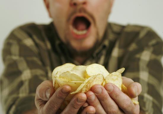 Model Released Man Binging On Crisps Editorial Stock Photo - Stock ...