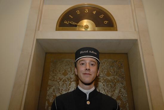 Hotel Bell Boy Standing By Lift Editorial Stock Photo - Stock Image ...
