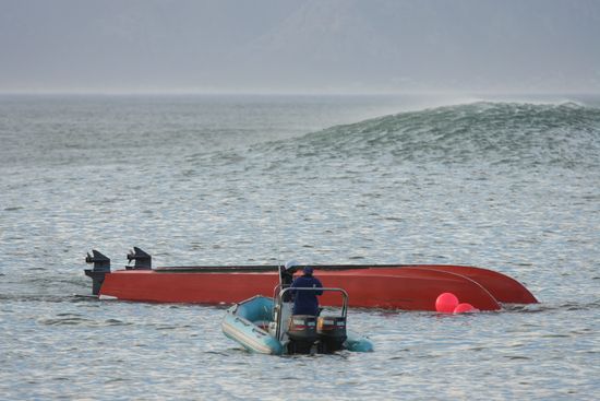 Badly Damaged Boat Being Towed Out Editorial Stock Photo - Stock Image ...