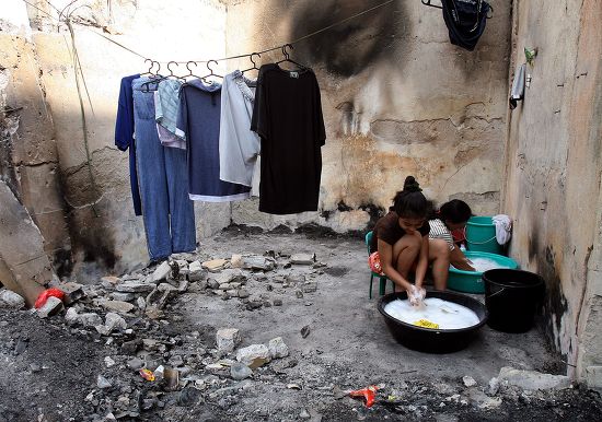 Filipino Women Wash Clothes Their Burnt Editorial Stock Photo - Stock ...