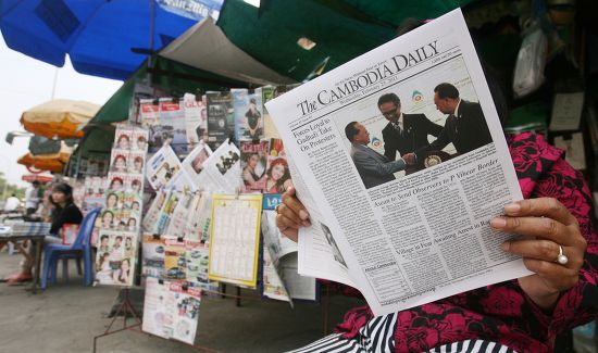 Cambodian Shopkeeper Reads Cambodia Daily Newspaper Editorial Stock ...